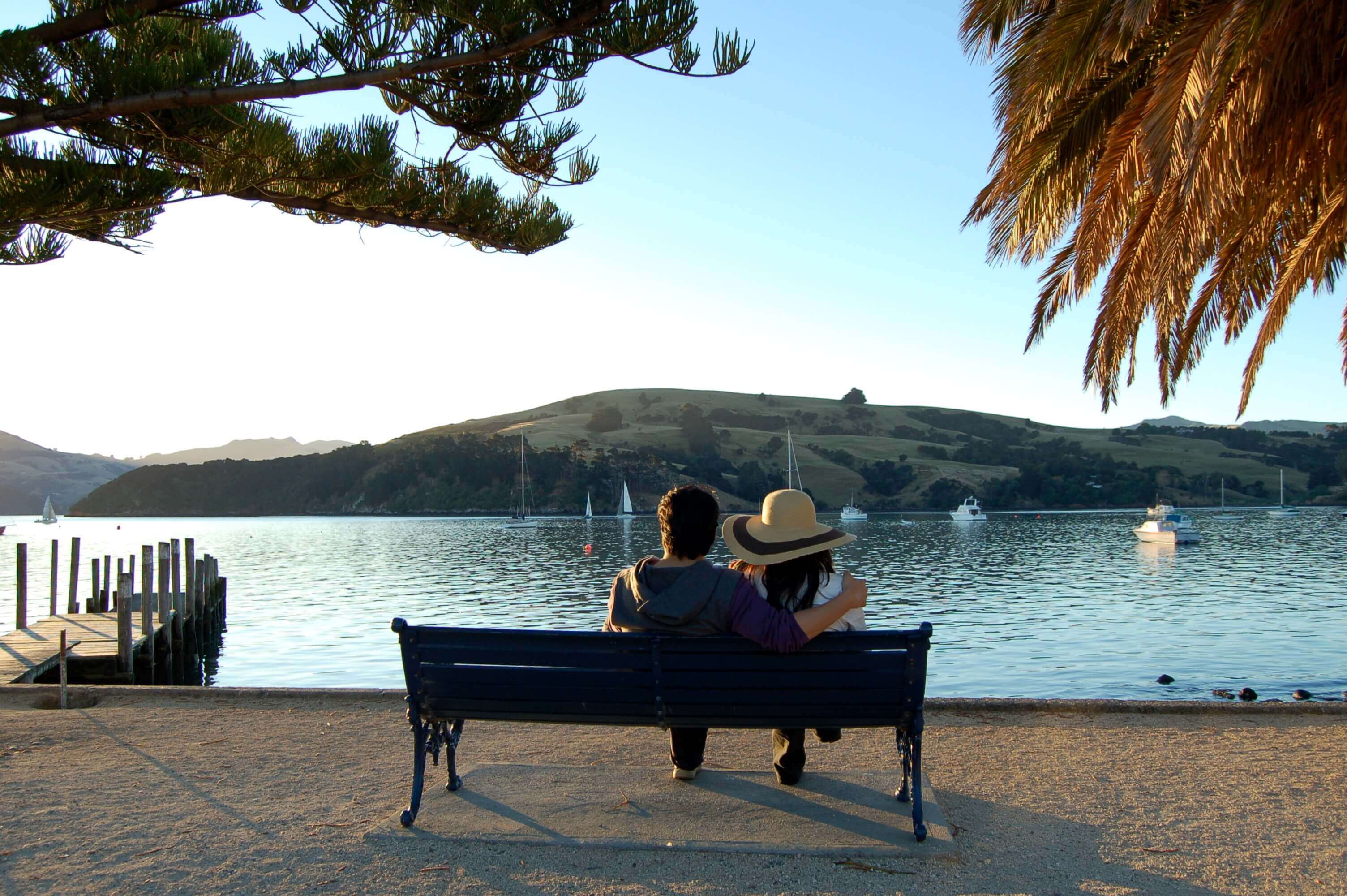 Couple on bench – Raquel Smith – Akaroa & the Bays
